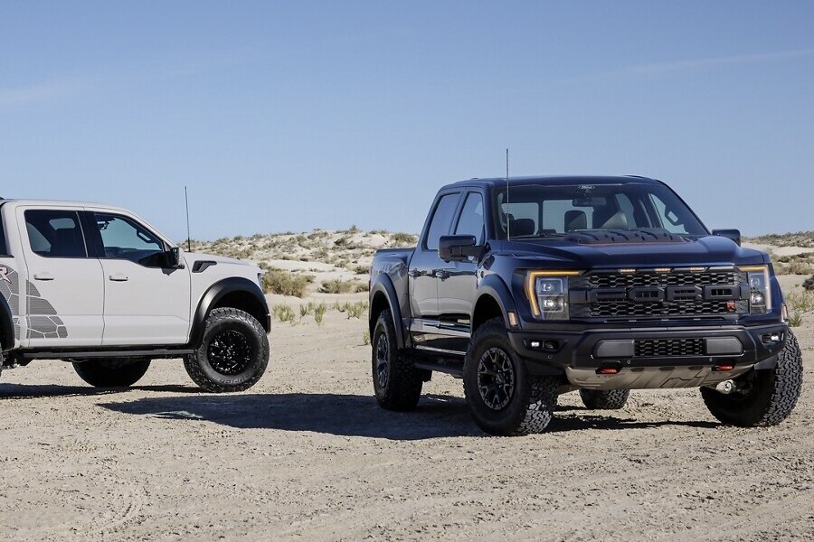 2023 Ford F-150® Raptor® and Raptor R™ trucks parked in the desert