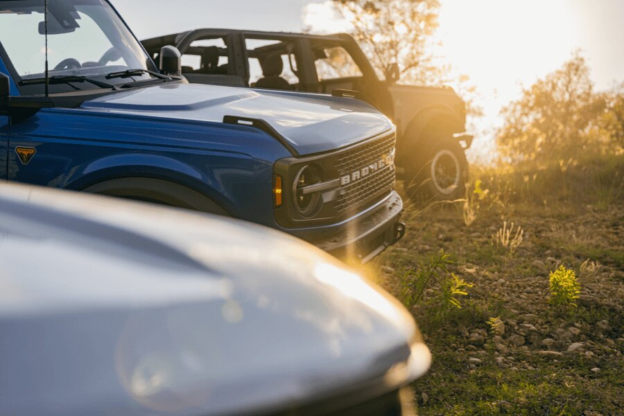 A group of 2023 Ford Bronco® SUVs parked on a hill